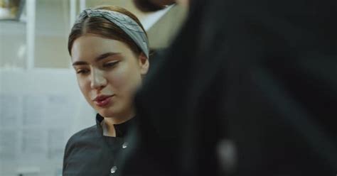 Head Chef Talking With Female Apprentice In Restaurant Kitchen Food