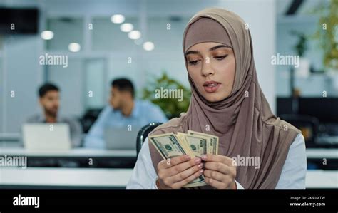 Serious Concentrated Eastern Muslim Girl In Hijab Office Worker Manager