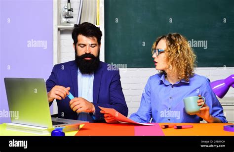 Students Studying In University Male Teacher And Female Student In