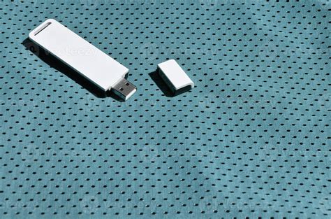A Modern Portable Usb Wi Fi Adapter Is Placed On The Blue Sportswear