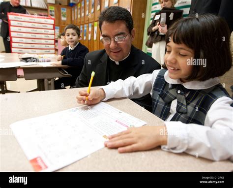 Catholic Bishop Speaks To Second Grade Girl Wearing Uniform At Private