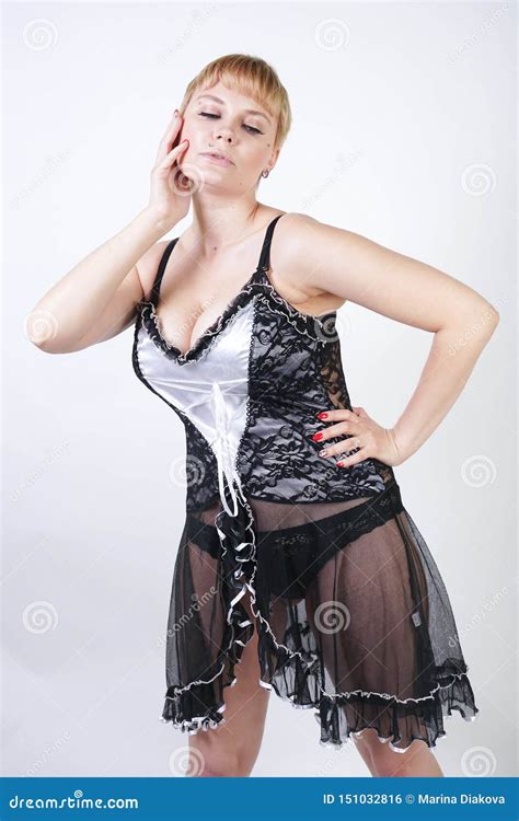 Pretty Short Blonde Hair Young Woman With Chubby Figure Wearing Black