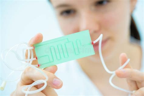 Young Woman Laboratory Assistant Mount Lab On Chip Loc Microfluidics Device Modeling Artificial