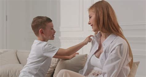 Time Of Son And Mother Together Mom Talks To Her Son Sitting On The
