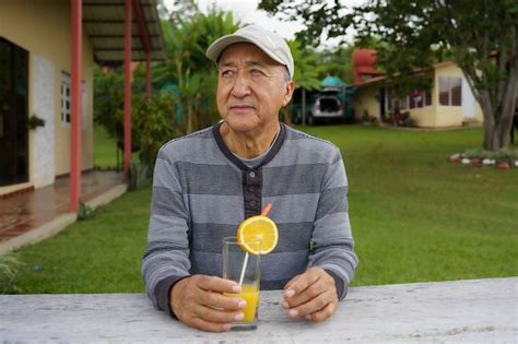 Premium Photo Adult Man Drinking Orange Juice