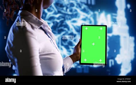 admin in data center with green screen tablet using artificial