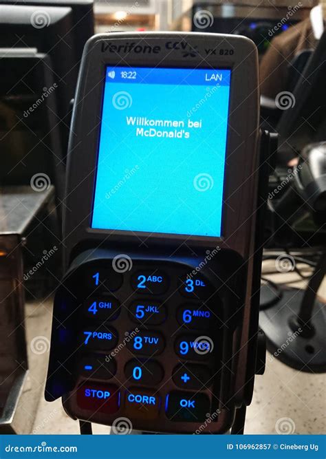 A Verifone Payment Terminal At A Gas Pump Featuring A Keypad Card Reader And A Screen