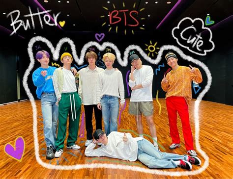 A Group Of Young Men Standing Next To Each Other On Top Of A Wooden Floor