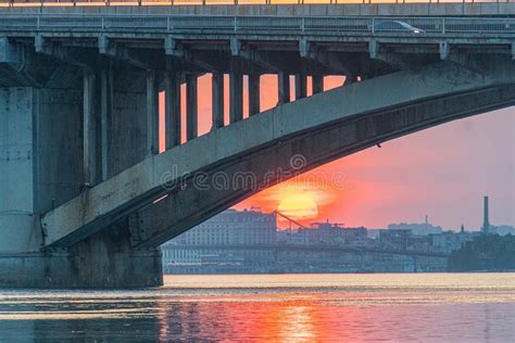 Image Of A Beautiful Sunset Over A Long Span Arch Bridge With Two Way Traffic Deck Spandrel