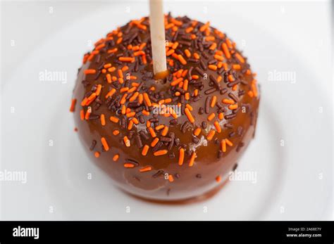 Caramel Apple With Orange And Brown Sprinkles Closeup This Fall