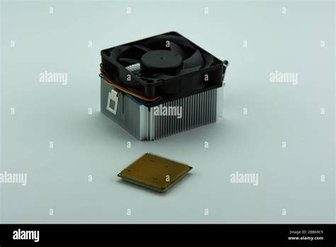 Multi Core Central Processing Unit Cpu And Aluminium Cooling Fan Isolated On White Background
