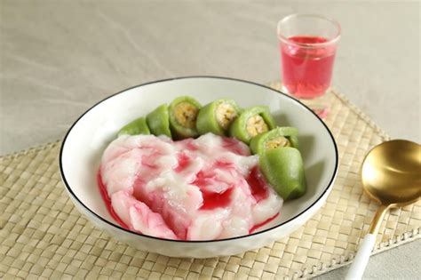 Premium Photo Es Pisang Ijo Traditional Dessert Of Plantain Banana Roll With Coconut Milk