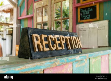 Close Up Of Wooden Reception Desk In A Low Budget Motel Tourism And