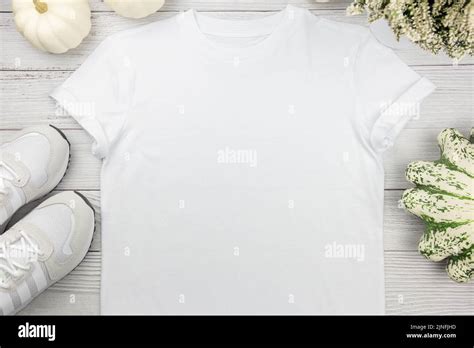 White Womens Cotton T Shirt Mockup With Pumpkins And Sneaker On White