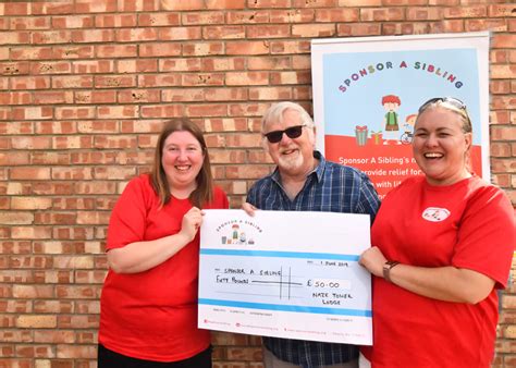 Simon Tallowin From Naze Tower Lodge Presenting A Cheque To Laura And Michelle From Sponsor A