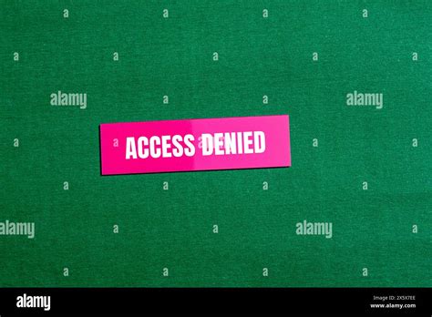 Access Denied Words Written On Pink Paper Sticker With Green Background