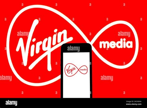 In This Photo Illustration A Virgin Media Inc Logo Seen Displayed On A