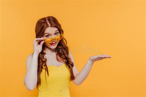 Beautiful Sensual Redhead Girl With Red Lips Posing With Cut Lemon