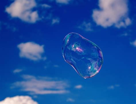 Premium Photo Low Angle View Of Bubble Against Blue Sky