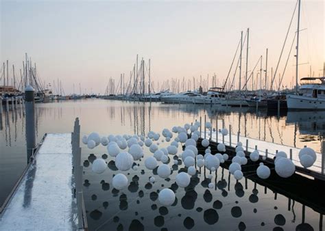Sensual Wave Installation Illuminates An Empty Dock At French Harbour