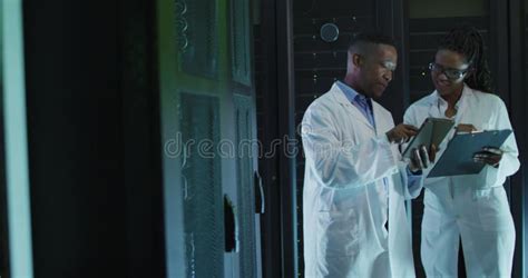 technicians using computers and tablet in data center implementing ai