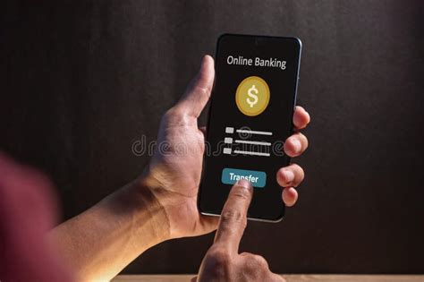 A Man Using A Smartphone To Access Online Mobile Banking Concept Of Money Transfer Or Payment