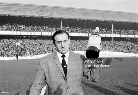 Everton Manager Harry Catterick Holds Up A Bottle Of Bells Whisky For