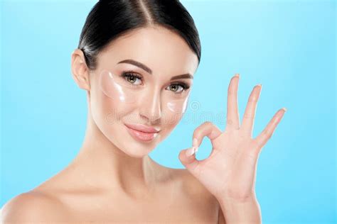 Perfect Girl With Nude Make Up And Naked Shoulders At Studio Background Invisible Eye Patches