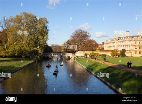 Cambridge University Autumn People Punting On The River Cam On The