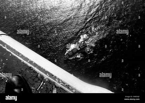 A Container Ship Passes Beneath A Hovering Helicopter Light Anti Submarine Squadron 94 Hsl 94