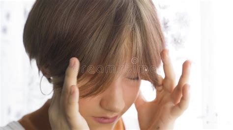 A Sick Girl Lies On The Bed Her Mother Touches Her Forehead Measures The Temperature Stock