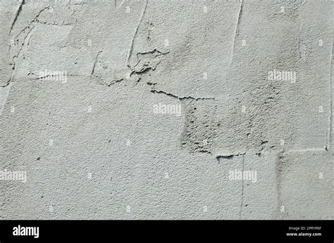 The Texture Of The Wall Covered With Gray Foam Polystyrene Plates Which Are Smeared With A