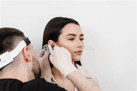 Otoscopy Otolaryngologist Is Looking Through Otoscope The Ears Of