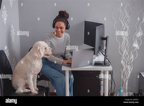 Young Pretty Female Programmer Writing Program Code On Computer Sitting