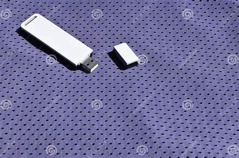 A Modern Portable Usb Wi Fi Adapter Is Placed On The Violet Sportswear