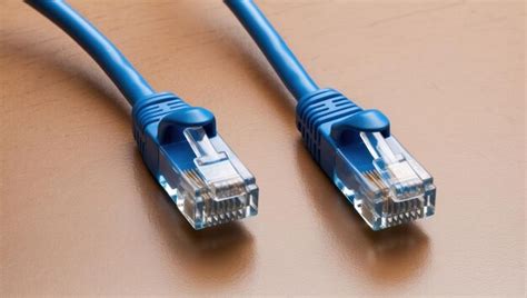 Premium Photo Close Up Of Ethernet Cables Connected To A Router On A Wooden Desk