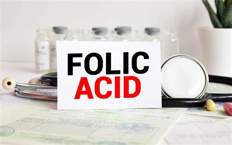 Premium Photo Folic Acid Text Written On Card On Wooden Table With