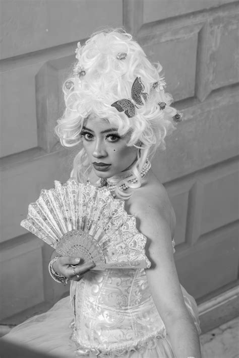 Standing Woman In Rococo Costume By Railing And Holding Hand Fan · Free