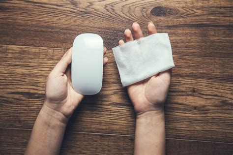 Premium Photo Woman Cleaning Computer Mouse