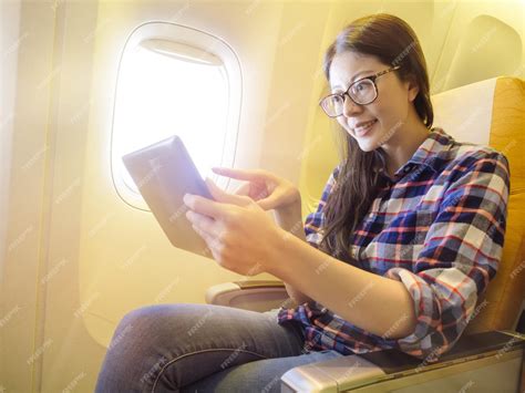 Premium Photo Sweet Beauty Woman Passenger Looking At Mobile Pad Computer And Pointing Screen