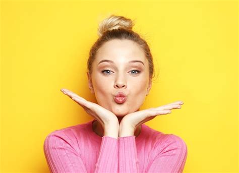 Premium Photo Beautiful Blond Woman With Kiss Gesture Portrait Of A