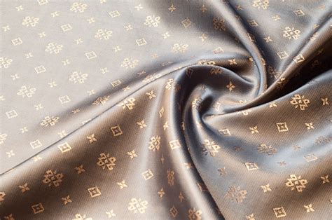 질감 배경 패턴입니다 갈색 실크 직물입니다 고급 직물 또는 액체 파도 물결 주름의 추상적인 배경 부드럽고 우아한 골든 실크 또는 공단에 세피아 톤 레트로 스타일 0명에 대한