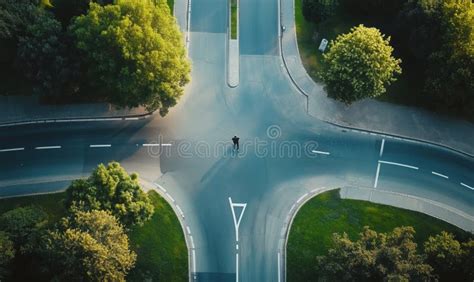 Man Standing At Crossroads Surrounded By Lush Greenery Aerial View Of