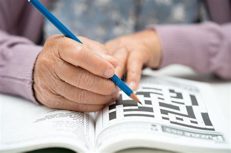Alzheimer Disease Ad Asian Elderly Woman Playing Sudoku Puzzle Game To Practice Brain Training