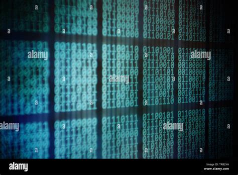 Computer Monitor Displaying Binary Code Block Of Data On Computer Led