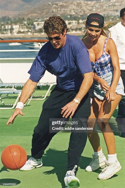 Actress Pamela Anderson And Actor David Hasselhoff Play Basketball On