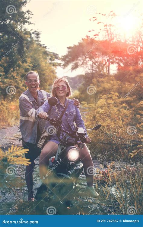 Asian Couples Riding Small Enduro Motorcycle Happiness On Jungle Track