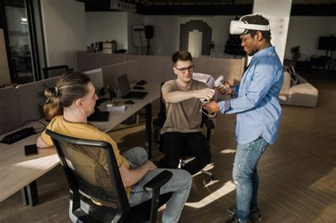 premium photo colleague helps put on vr headset testing metaverse