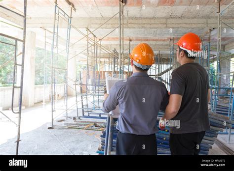 Construction Concepts Engineer And Architect Working At Construction Site With Blueprint Stock