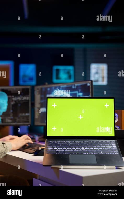 Focus On Green Screen Laptop Used By Developer To Update Artificial Intelligence Machine